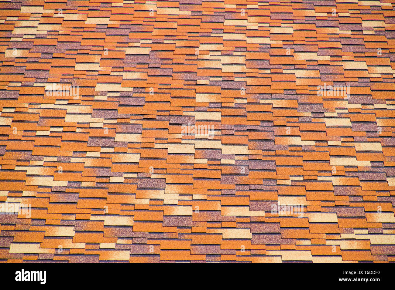 Roof from multi-colored bituminous shingles. Patterned bitumen shingles ...
