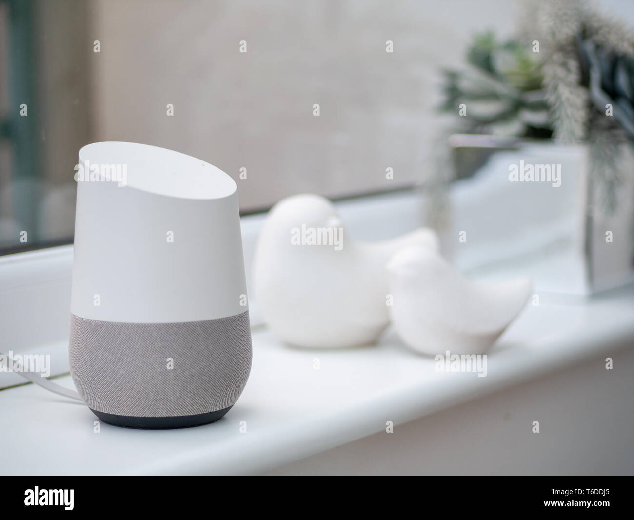 Smart home bluetooth speaker assistant in home setting Stock Photo - Alamy