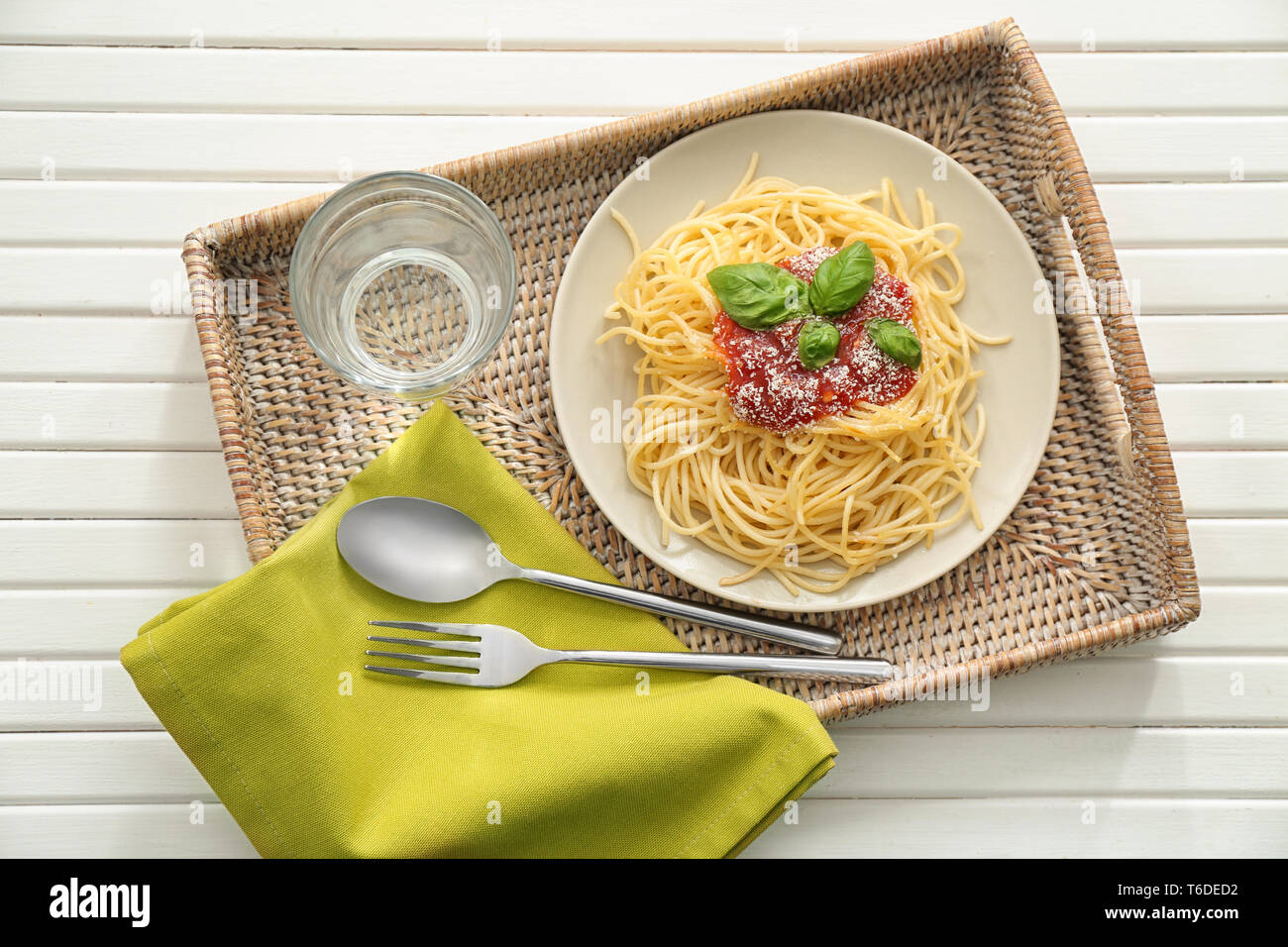 Plate with spaghetti and sauce on tray. Delicious pasta recipes Stock ...