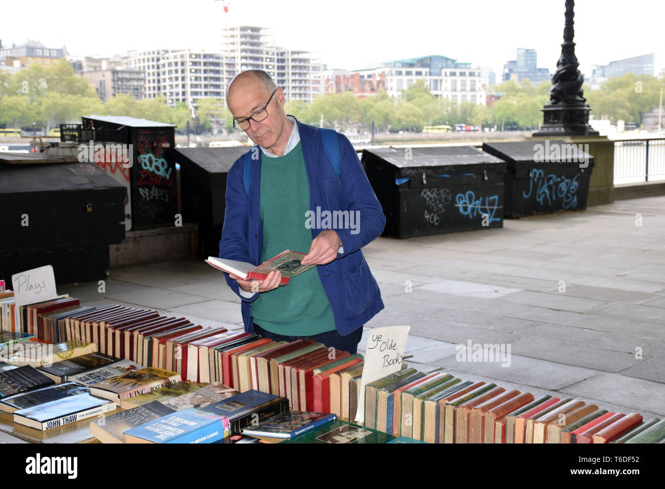 Second hand book stall on South Bank, London UK April 2019. Posed by ...