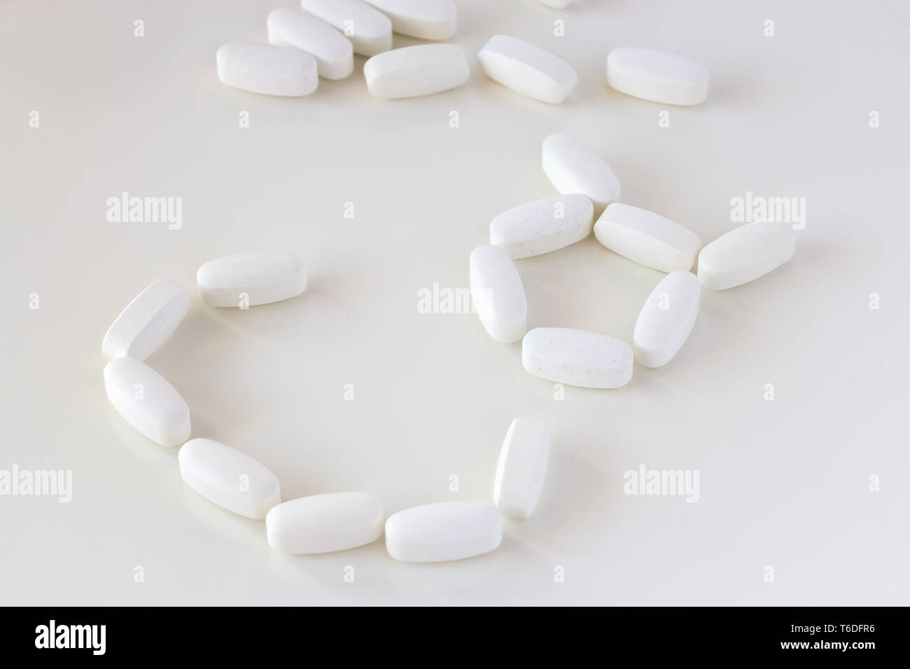 Close up white Calcium carbonate or Vitamin and mineral pills tablets ...