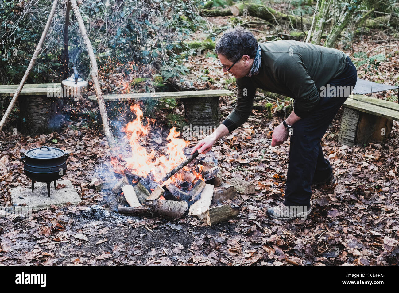 Man stoking fire hi-res stock photography and images - Alamy