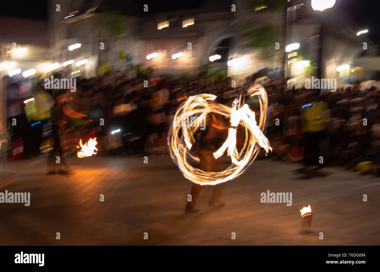 Night party. Amazing fire show performance. Long exposure Stock Photo ...
