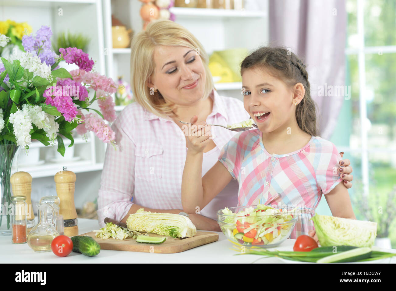 Portrait of mother and daughter cooking together Stock Photo - Alamy