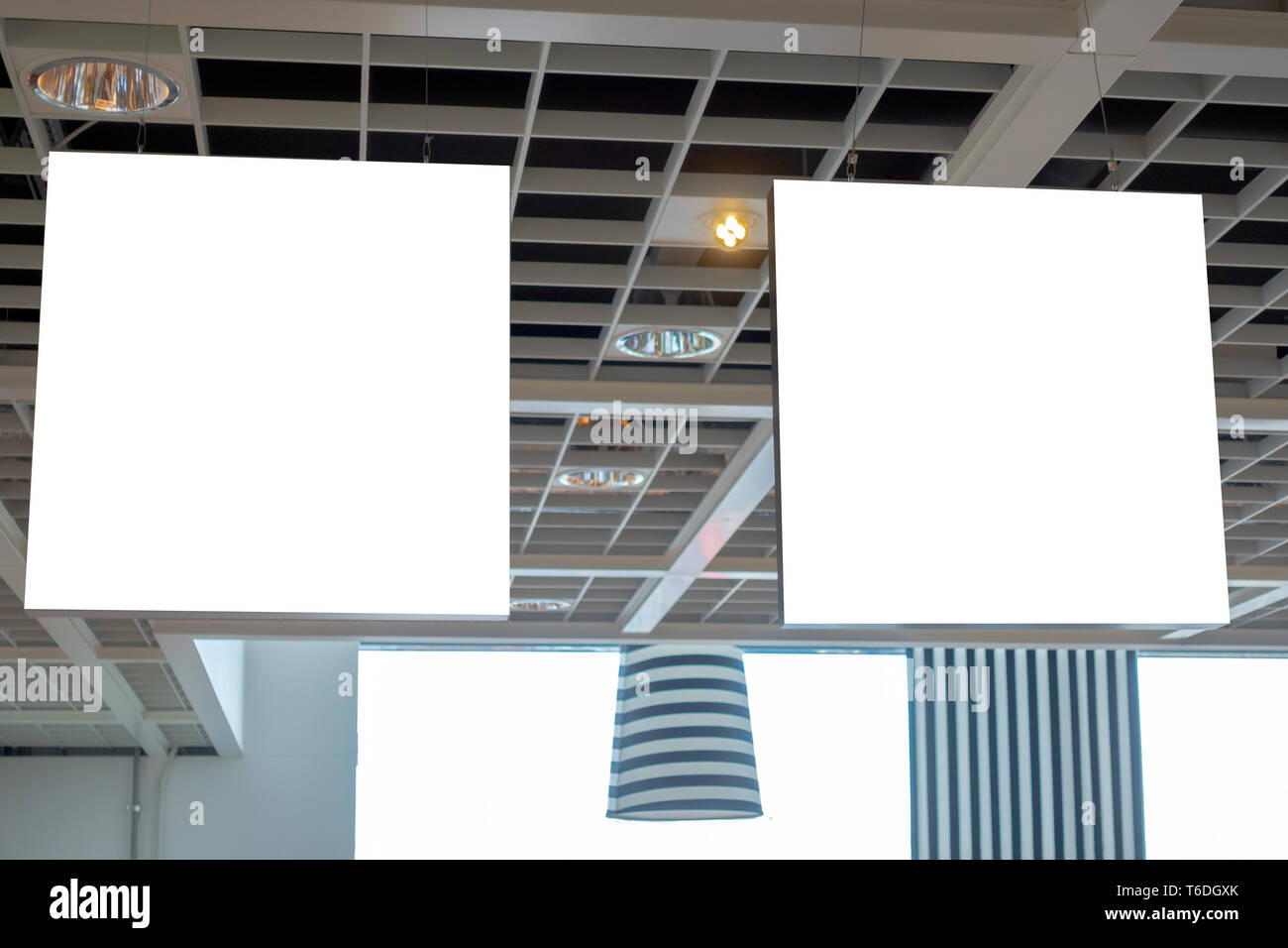 Two blank white mockup signboard hanging on ceiling Stock Photo - Alamy