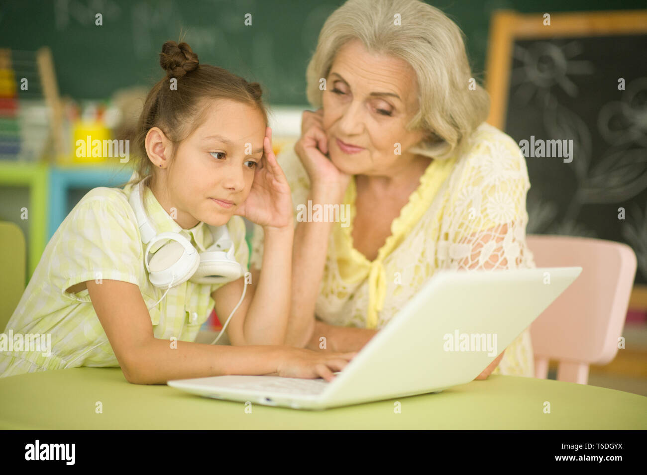 Grandmother and daughter using modern laptop at home Stock Photo - Alamy