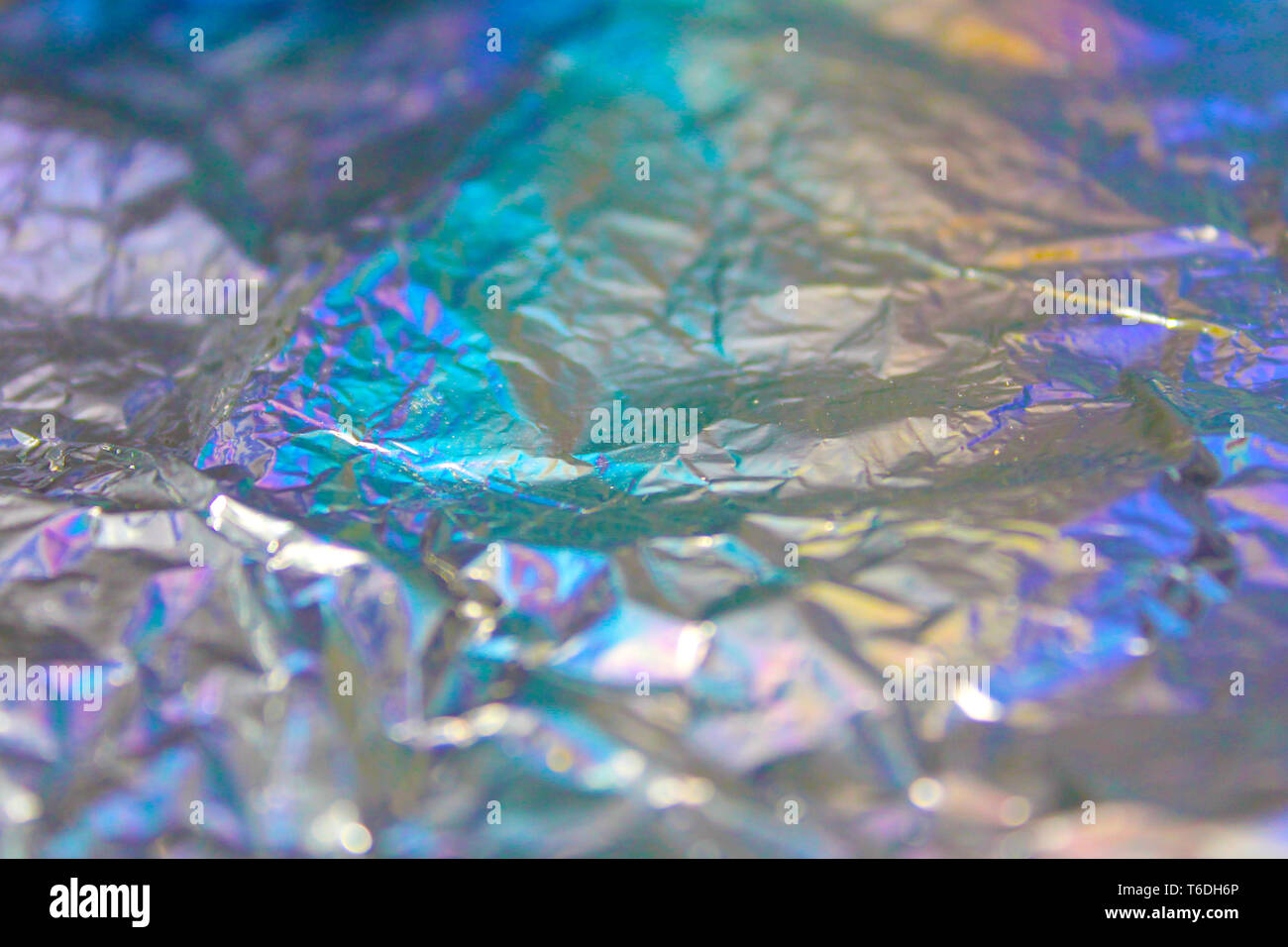Holographic iridescent foil texture background. It can be used for ...
