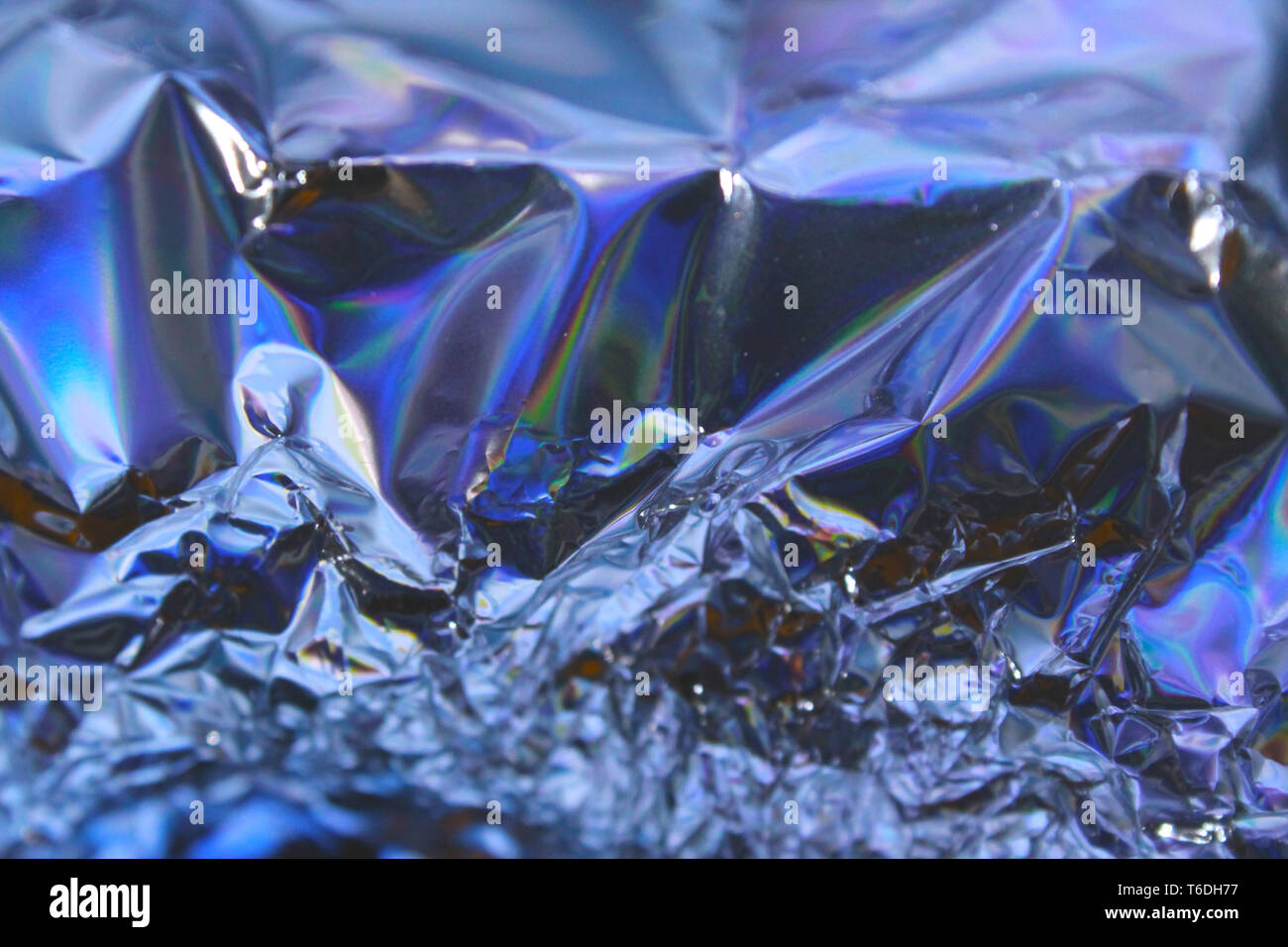 Holographic iridescent foil texture background. It can be used for ...