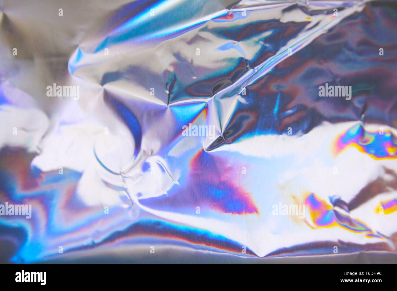 Holographic iridescent foil texture background. It can be used for ...