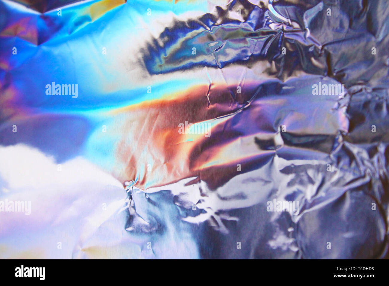 Holographic iridescent foil texture background. It can be used for ...