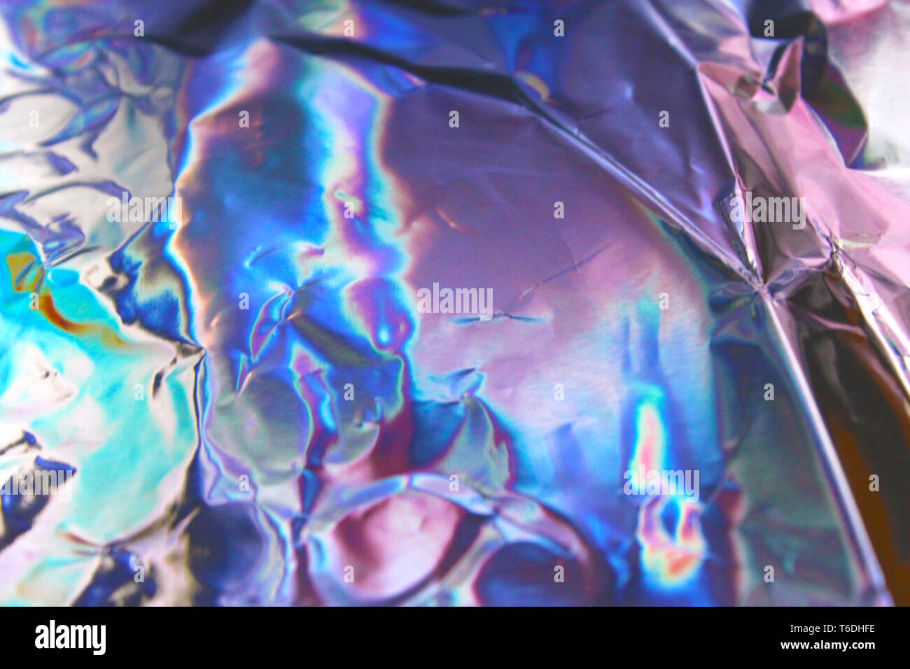 Holographic iridescent foil texture background. It can be used for ...