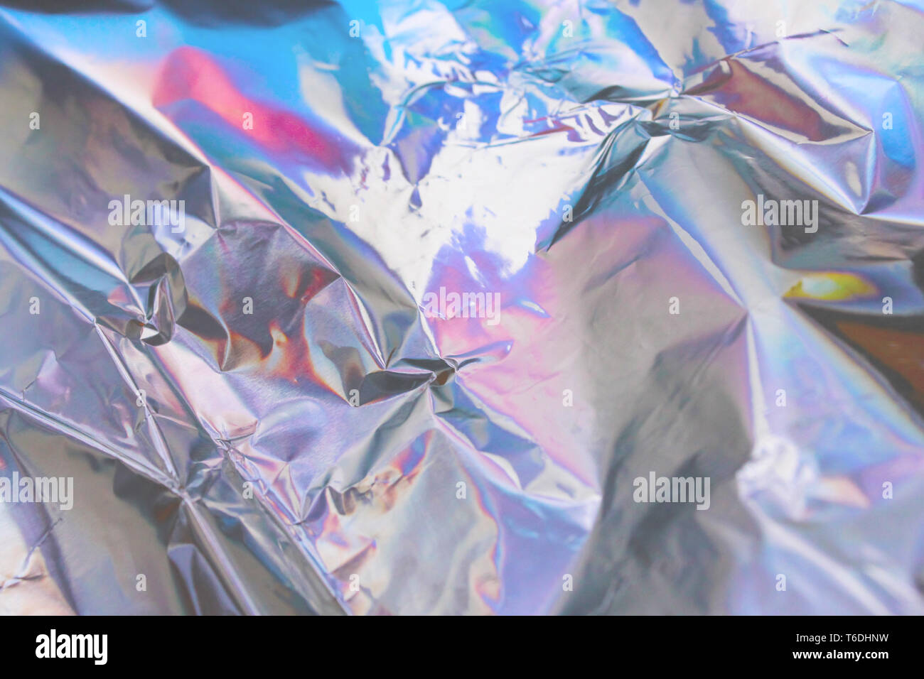 Holographic iridescent foil texture background. It can be used for ...