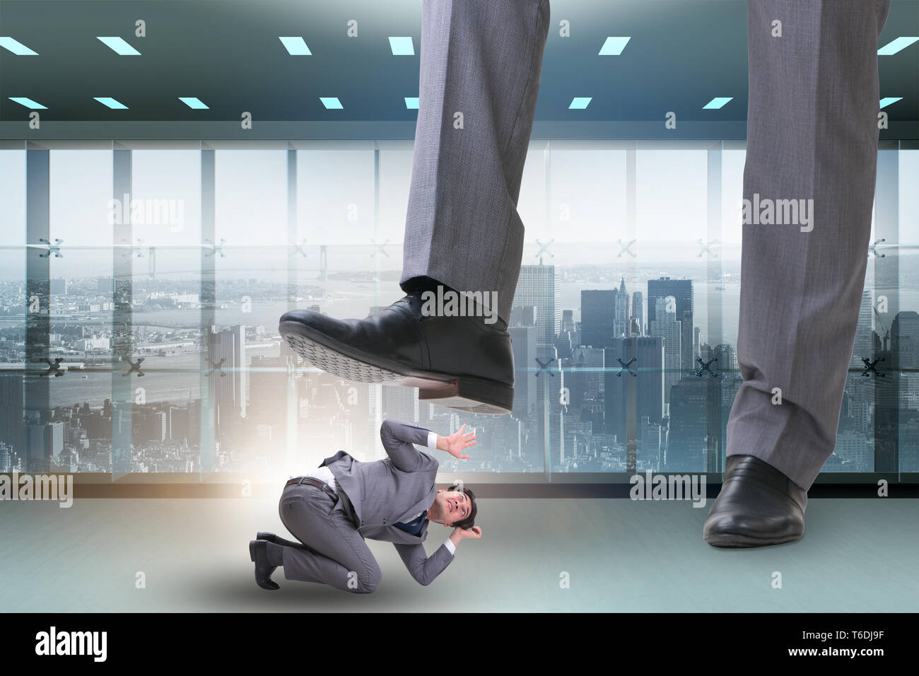 Bad angry boss stamping on employee in business concept Stock Photo - Alamy