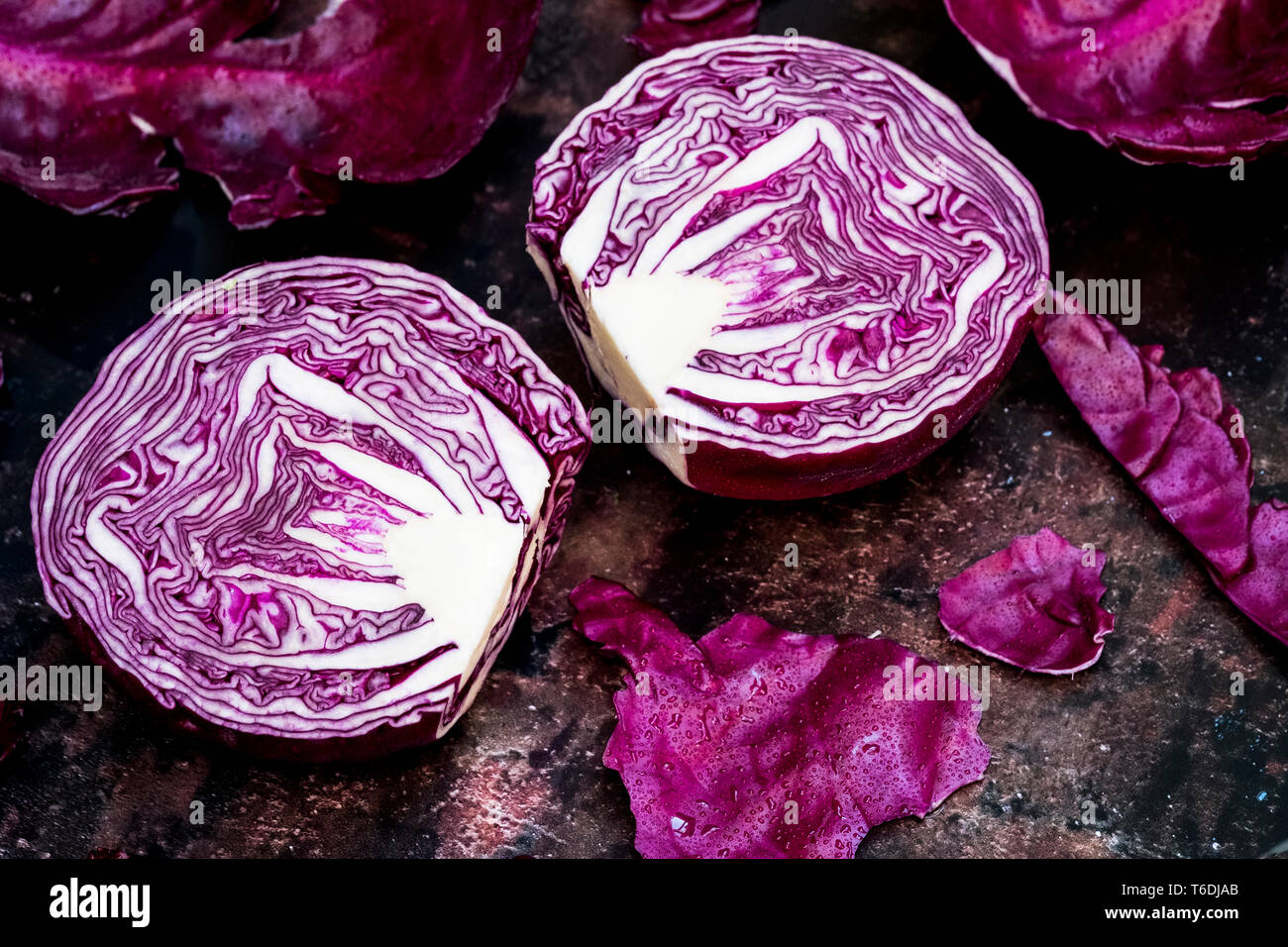 A raw round red cabbage, cut across the middle Stock Photo - Alamy