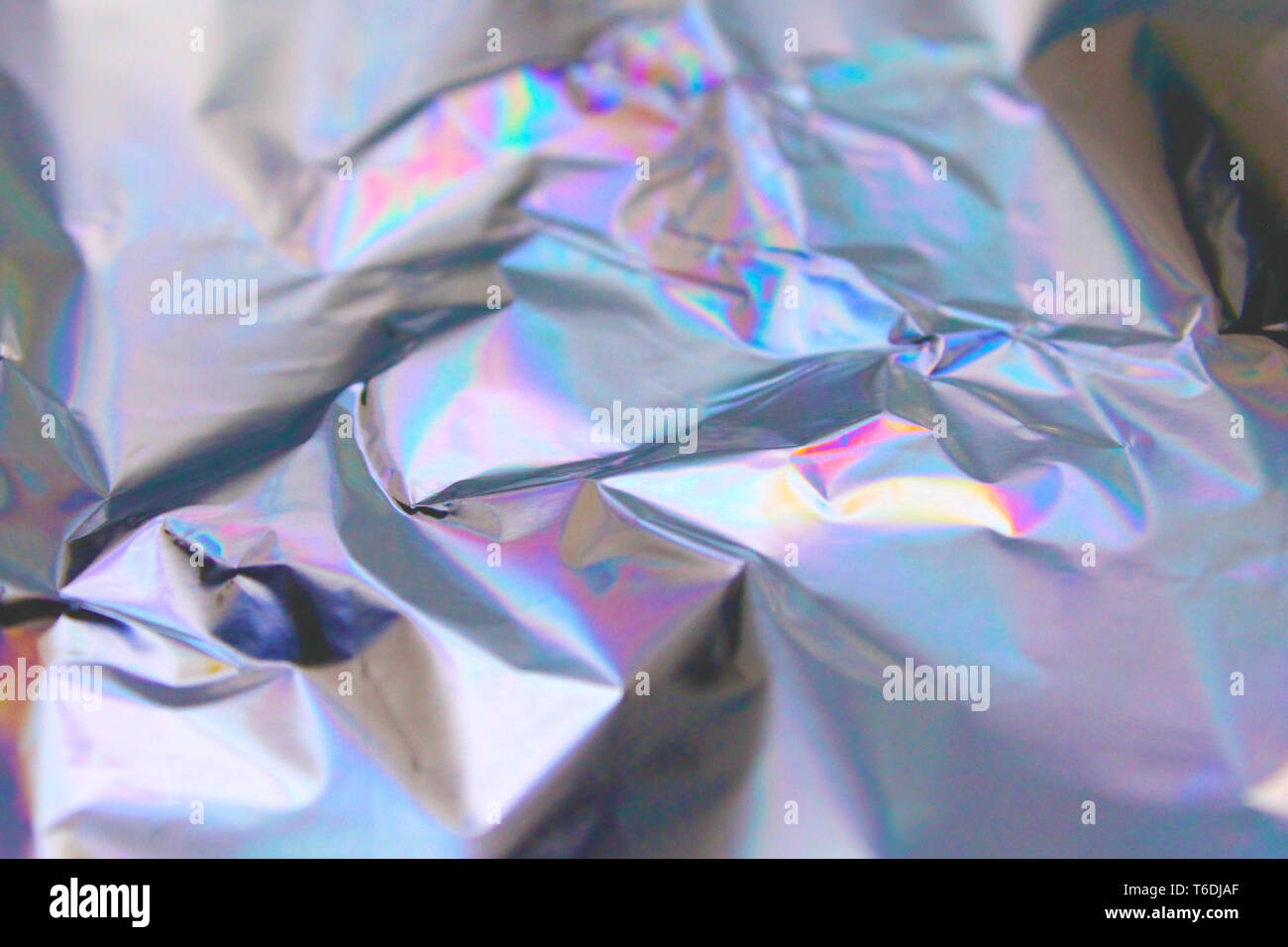 Holographic iridescent foil texture background. It can be used for ...