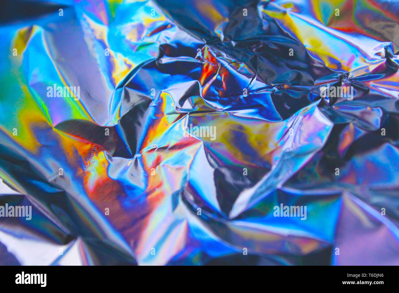 Holographic iridescent foil texture background. It can be used for ...