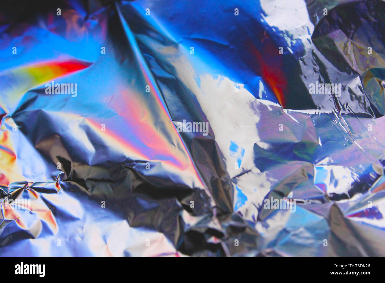 Holographic iridescent foil texture background. It can be used for ...