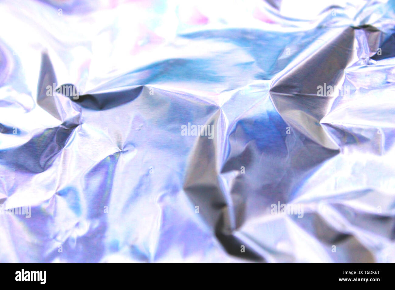 Holographic iridescent foil texture background. It can be used for ...