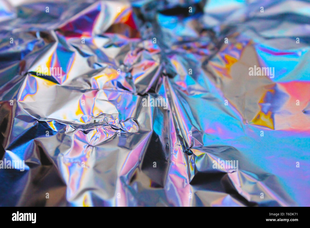 Holographic iridescent foil texture background. It can be used for ...