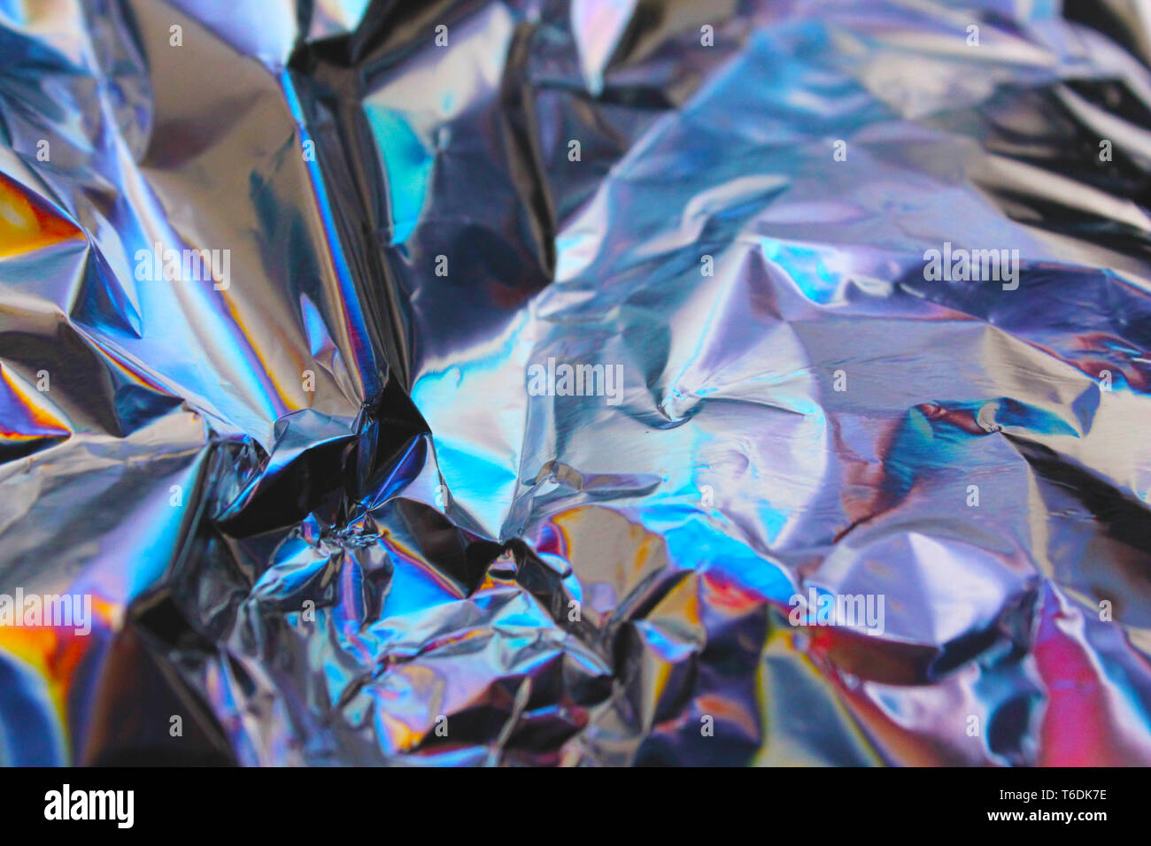 Holographic iridescent foil texture background. It can be used for ...