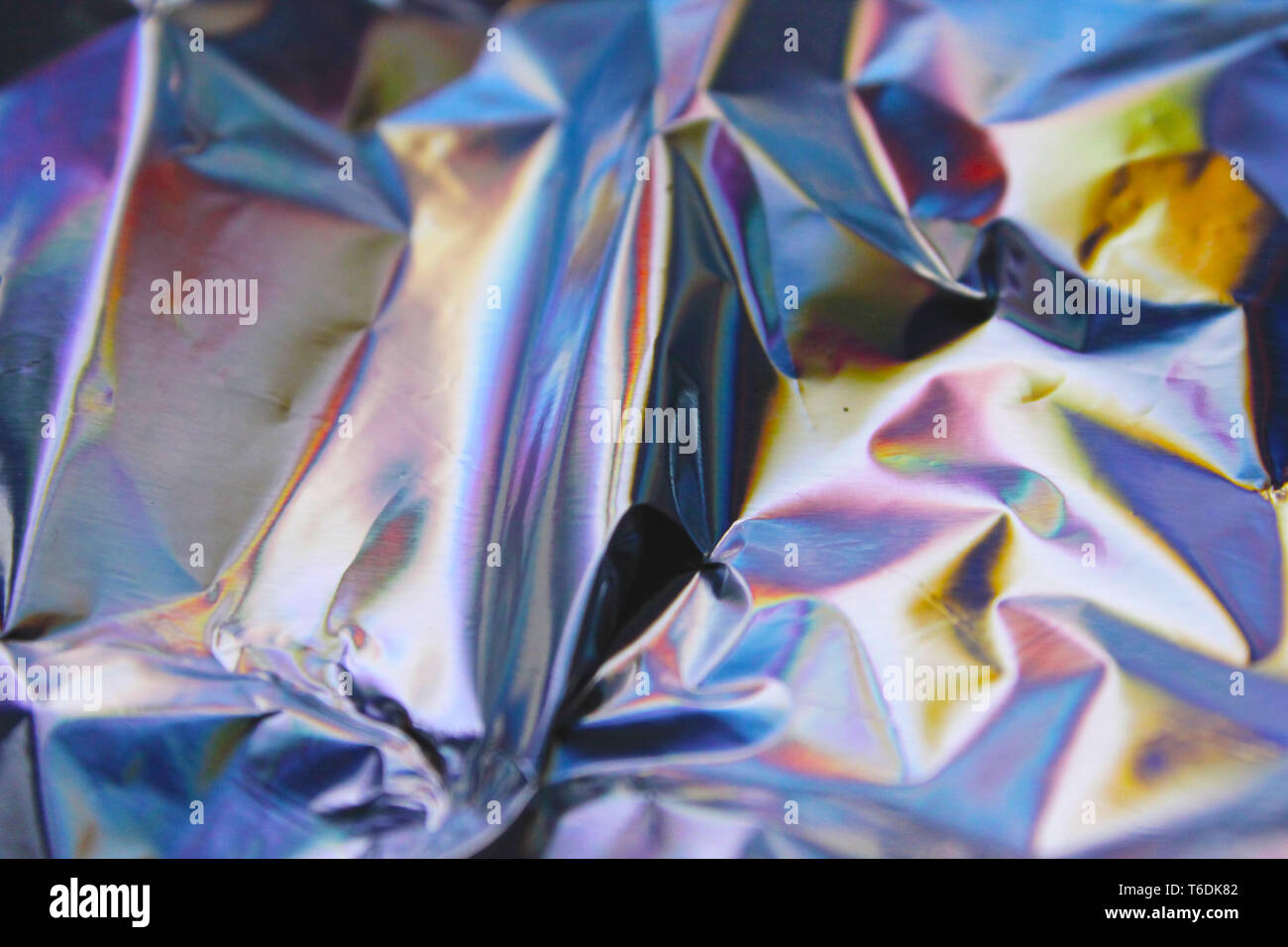 Holographic iridescent foil texture background. It can be used for ...