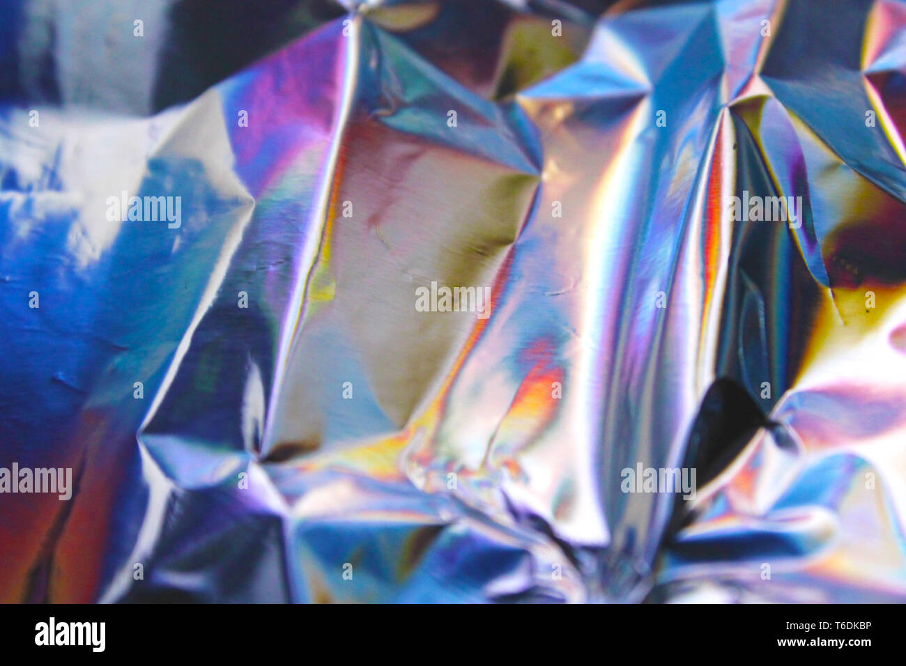 Holographic iridescent foil texture background. It can be used for ...