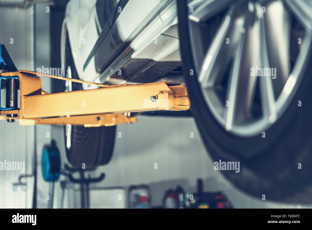 Broken Car on a Lift. Vehicle Repairing Service. Automotive Industry ...