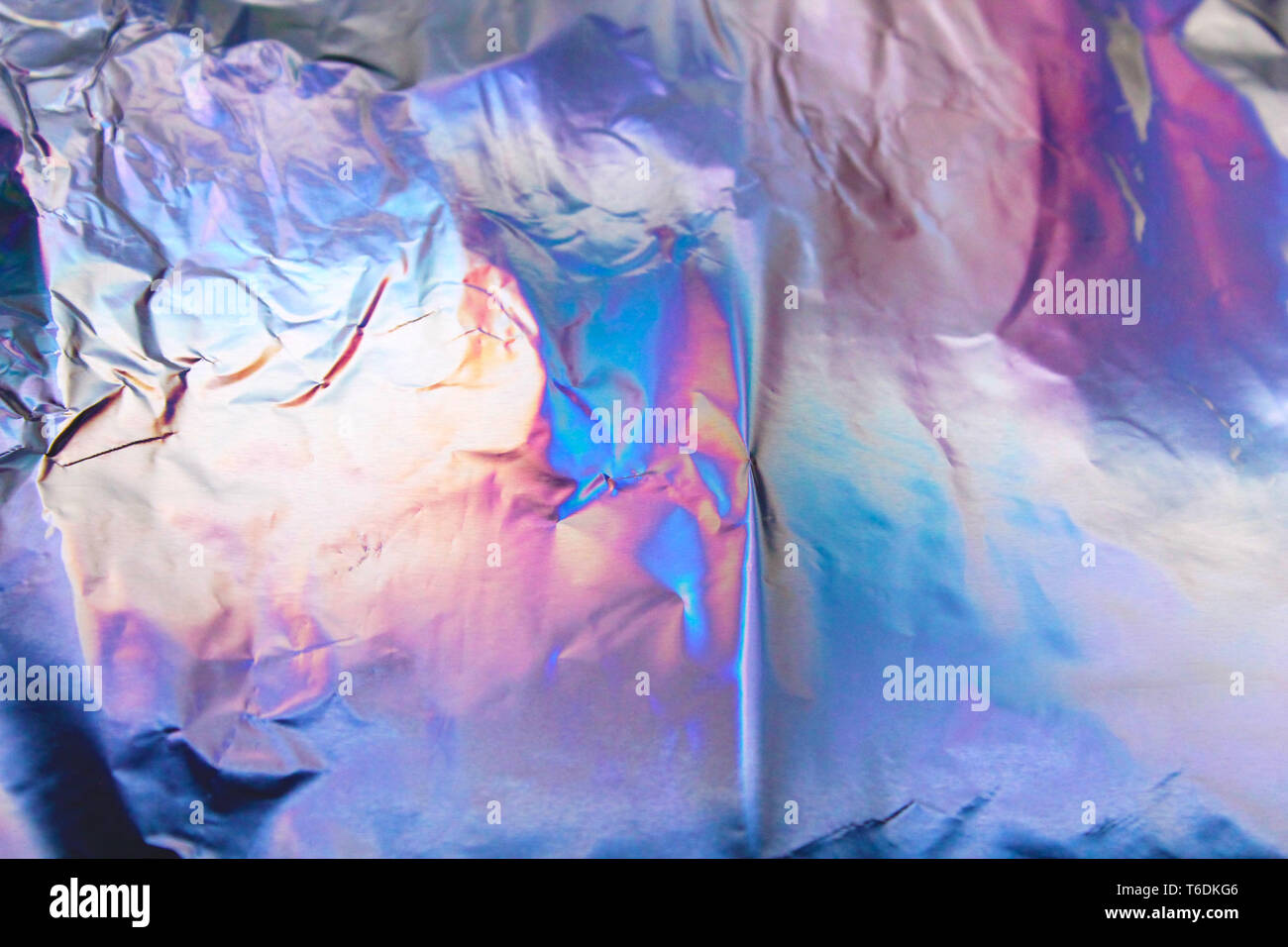 Holographic iridescent foil texture background. It can be used for ...