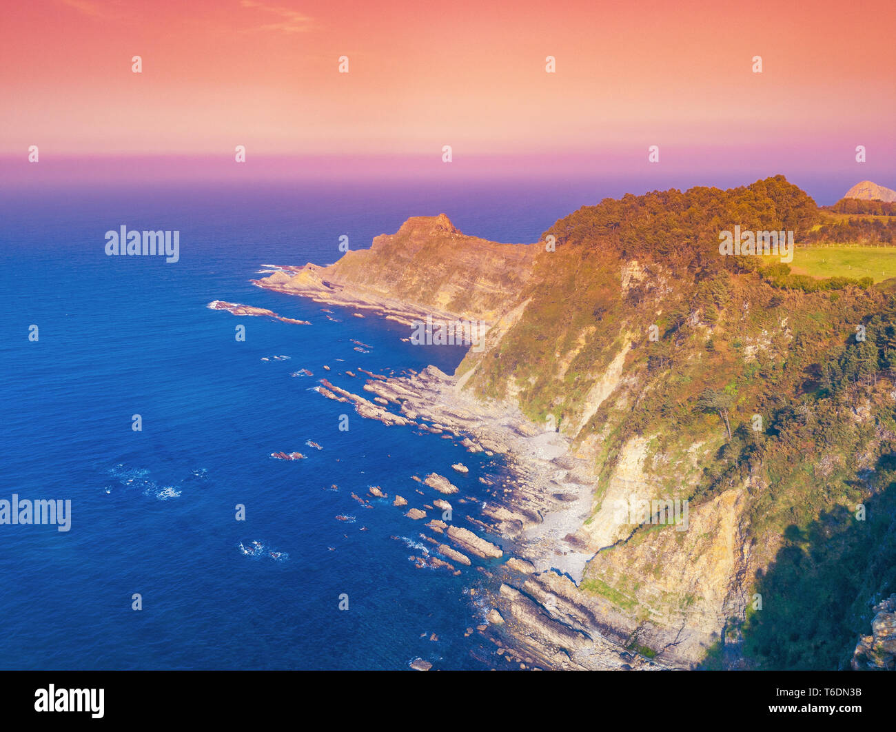 Aerial view of ocean and rocky coast at sunset. Galicia, Spain Stock ...