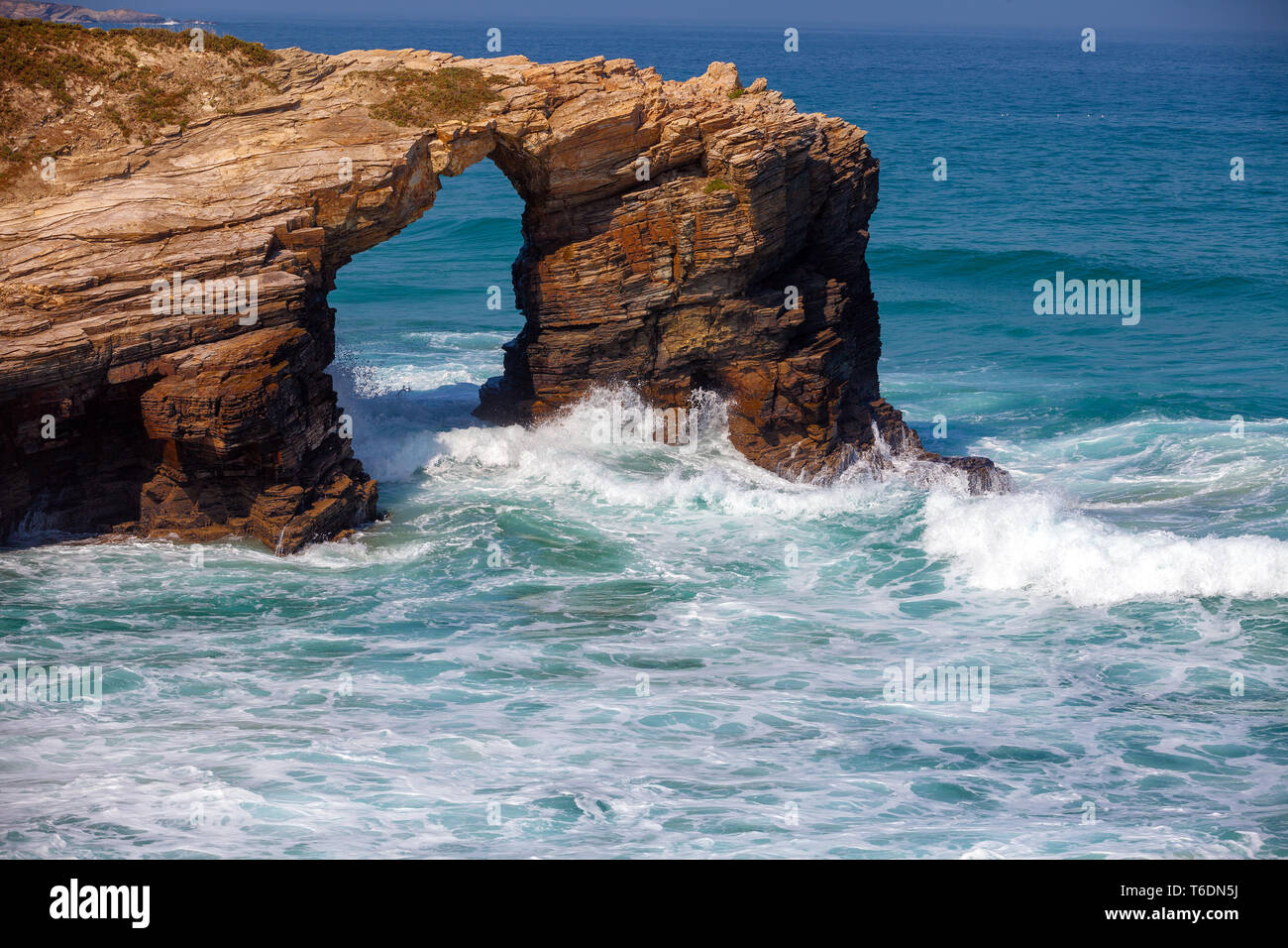 Arch in the rock. Beach Playa de Augas Santas (Beach of the Holy Waters ...