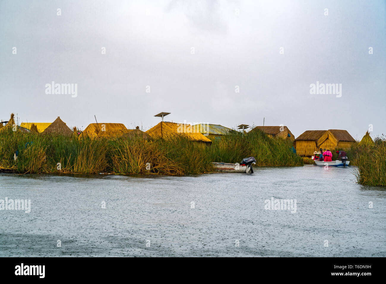 Soft focus view of Uros floating island on Titicaca Lake in the rain ...