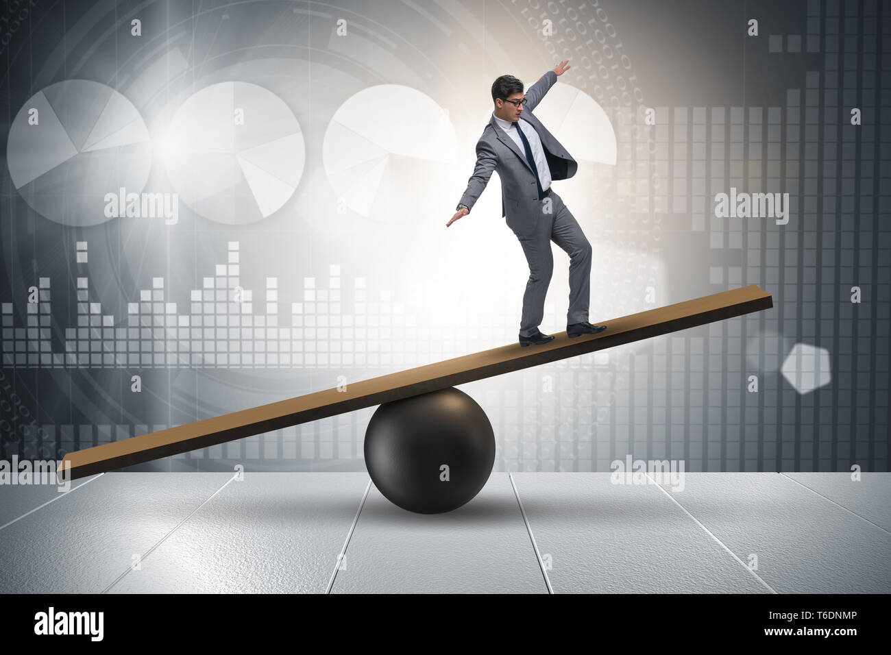 Businessman trying balance on hi-res stock photography and images - Alamy