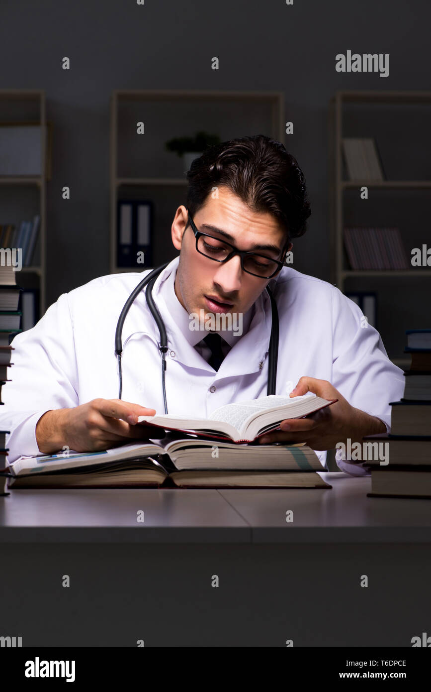 Medical student preparing for university exams at night Stock Photo - Alamy
