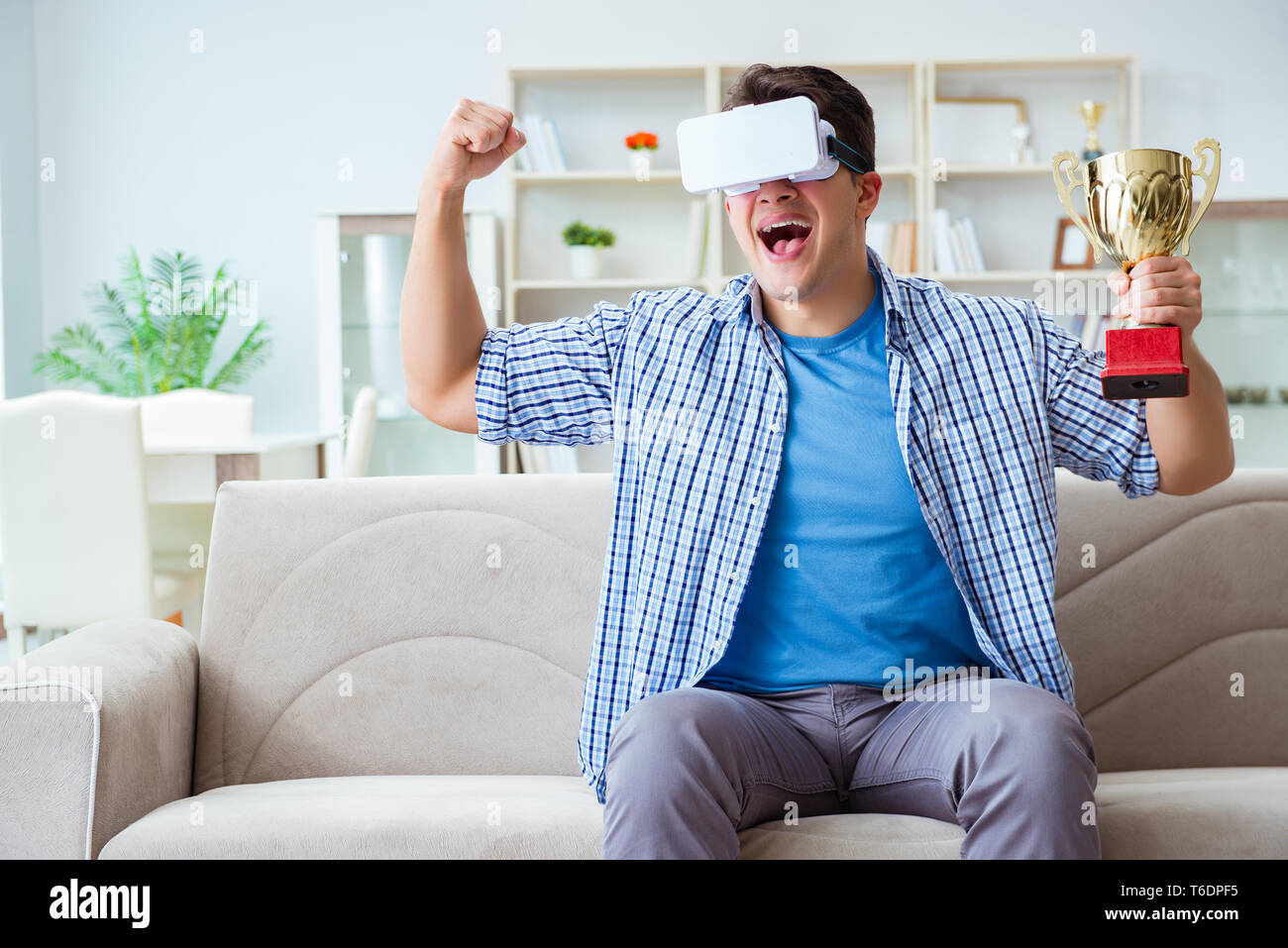 Man wearing virtual reality VR glasses receiving prize cup award Stock ...