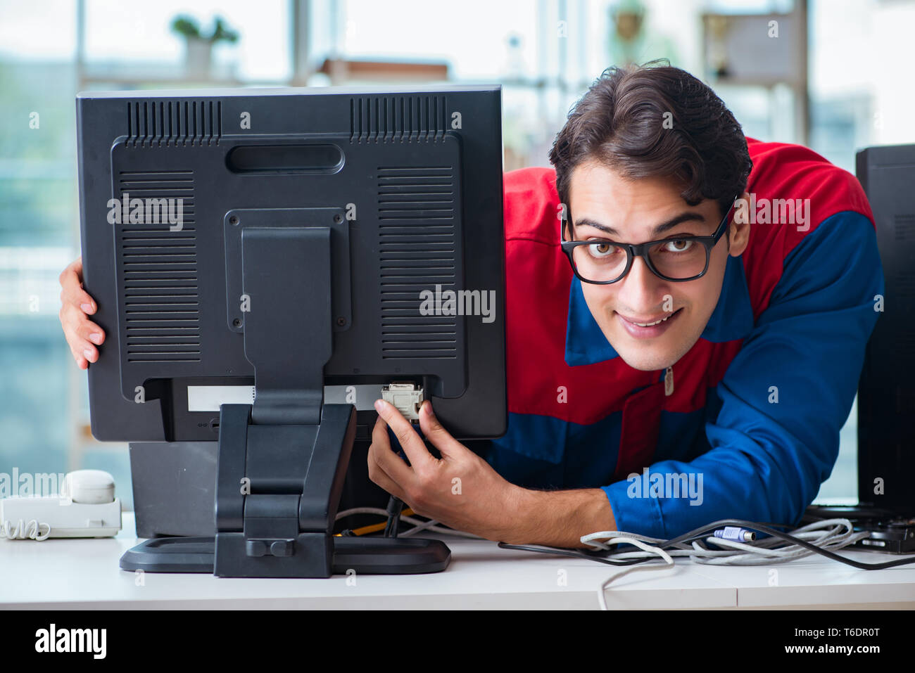 Computer repairman working on repairing computer in IT workshop Stock ...