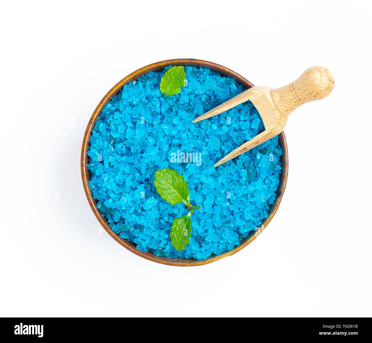 Top view of wood spoon in blue bath salt and mint leaves isolated on ...
