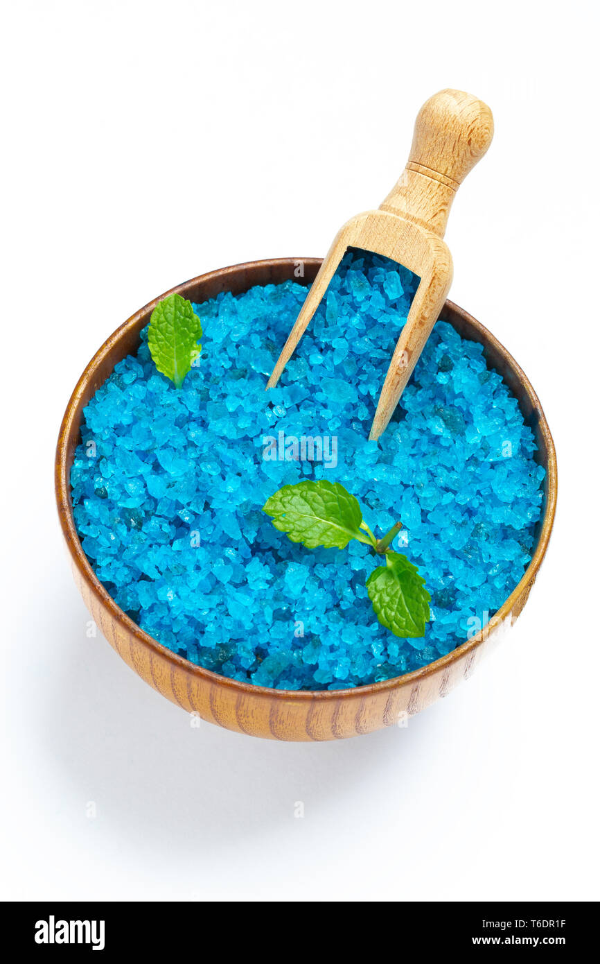 Wood spoon in blue bath salt isolated on white background Stock Photo ...