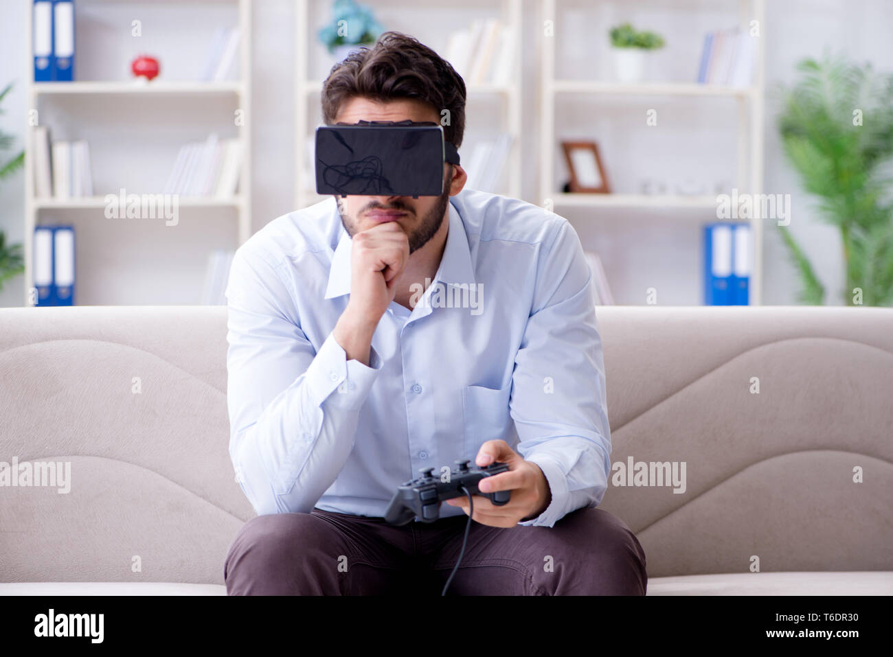 Student gamer playing games at home Stock Photo - Alamy