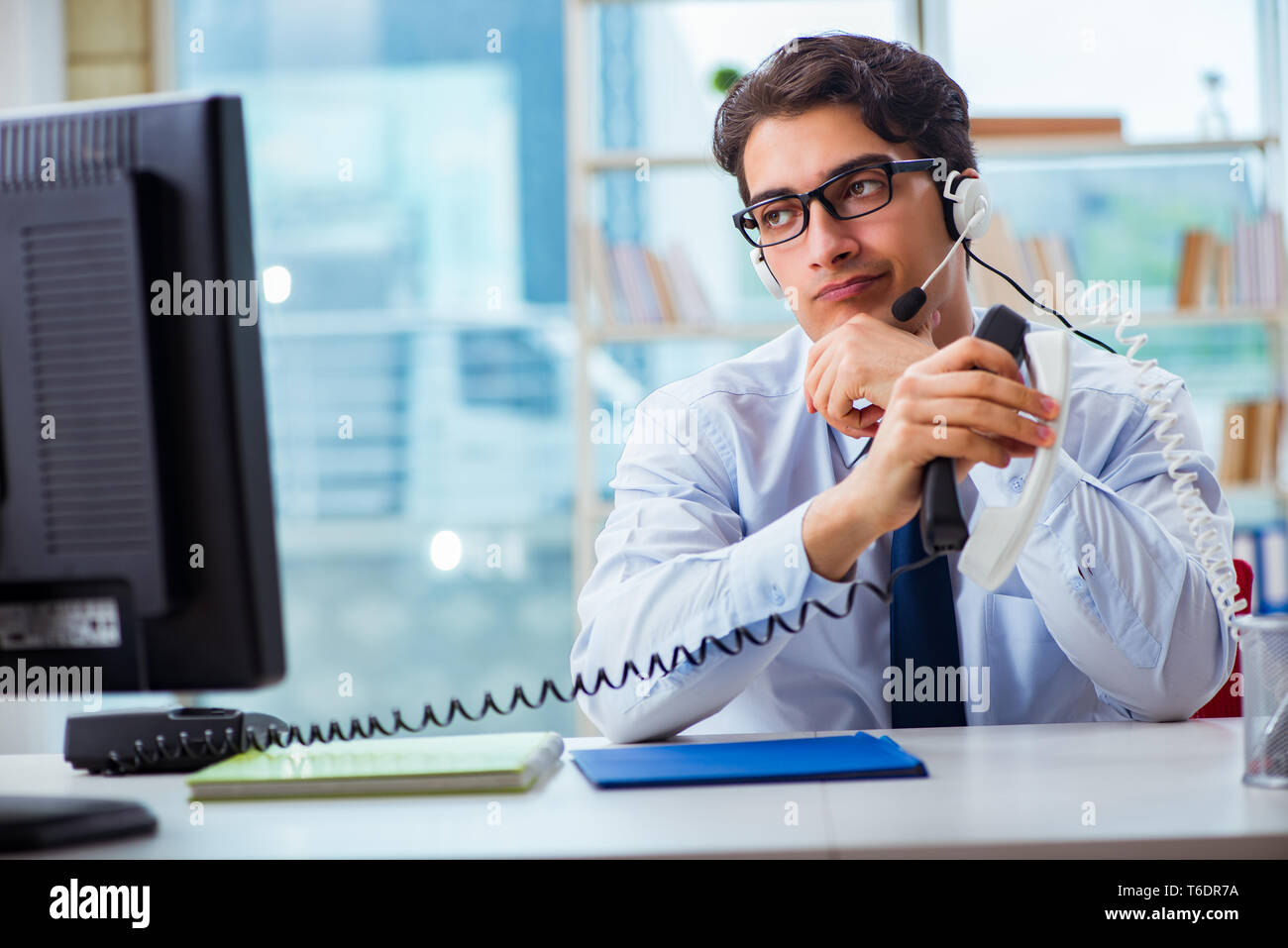 Unhappy receptionist hi-res stock photography and images - Alamy
