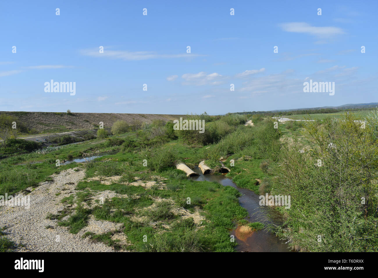 Blackened waste water from industrial plants and waste ponds flowing ...