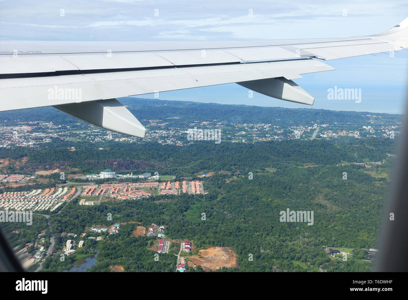 Airplane's wing flying thousand feet up in the air Stock Photo - Alamy