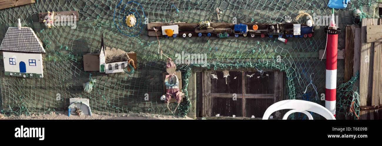 Beach Huts and other Objects out of Flotsam and Jetsam Stock Photo - Alamy