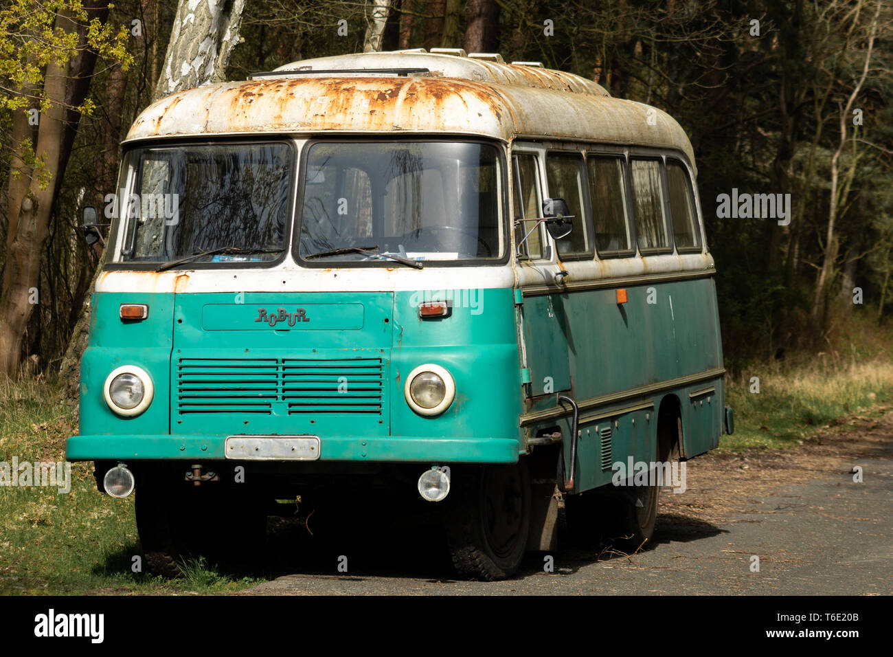 Old abandoned rusty 70s robur bus with a delightful light blue ...
