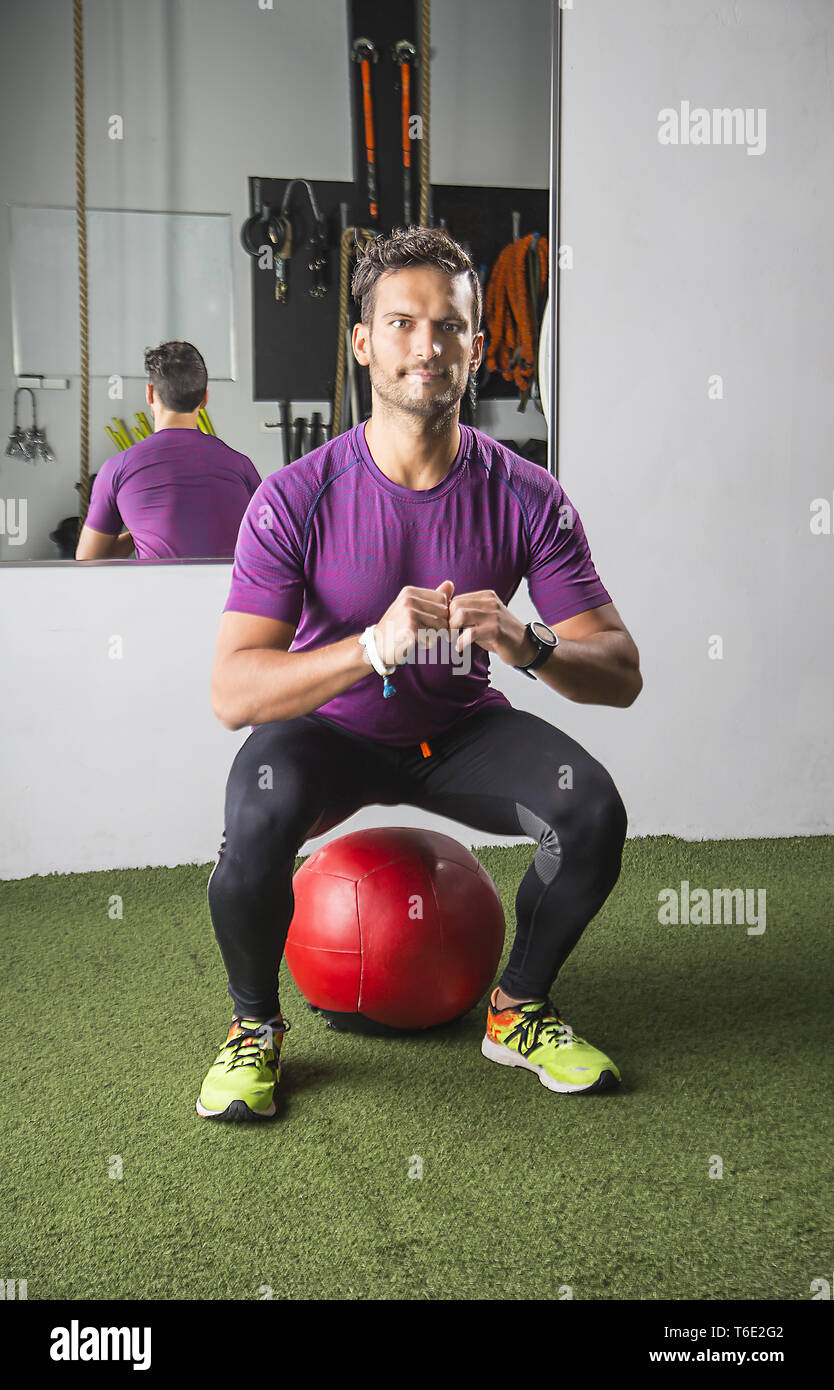 Exercising man squat hi-res stock photography and images - Alamy