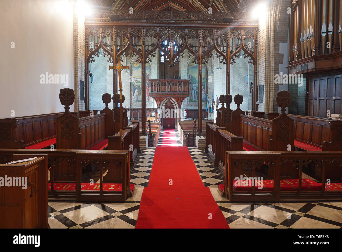 View of the interior of a church looking down the aisle from the high ...