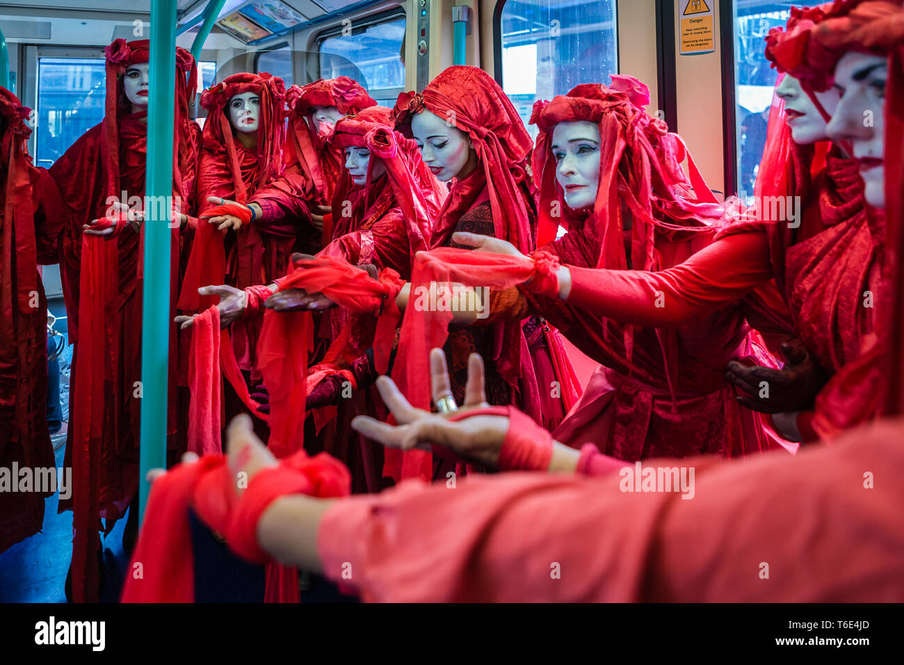 Red Brigade of Extinction Rebellion ride the subway Stock Photo - Alamy