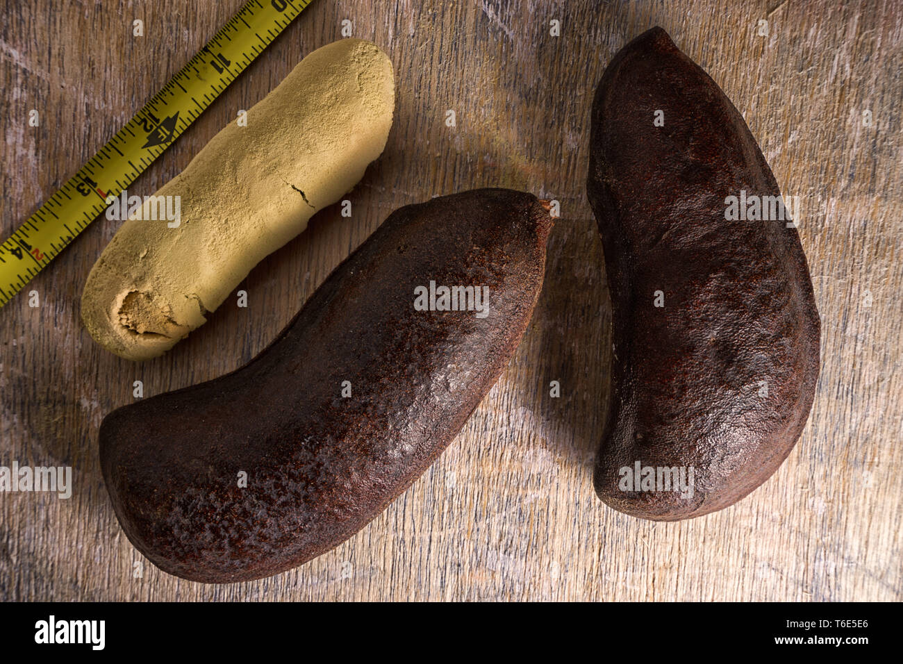stinking toe fruit closeup on wood surface Stock Photo - Alamy
