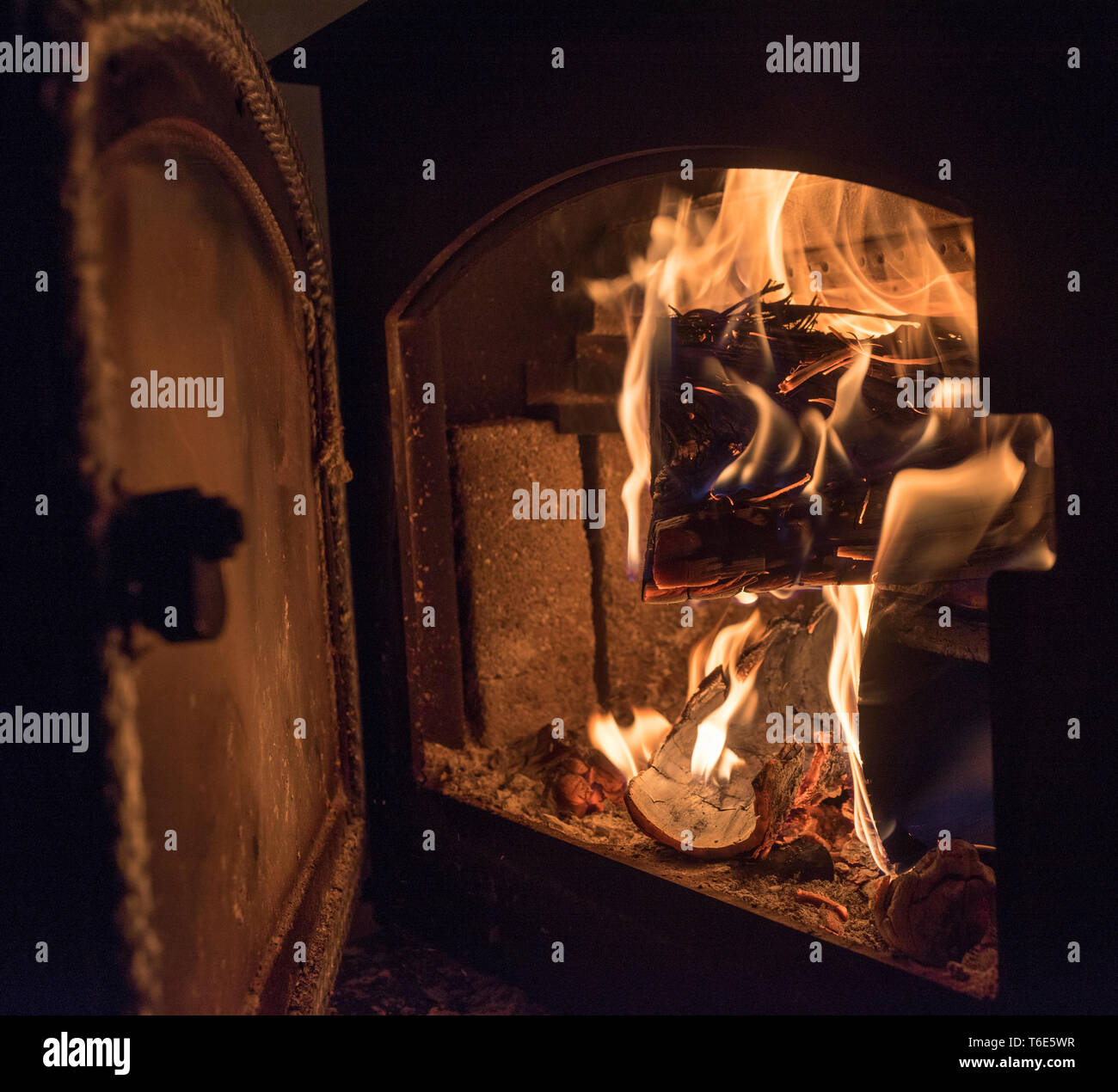 wood burning inside of a wood burning stove Stock Photo - Alamy