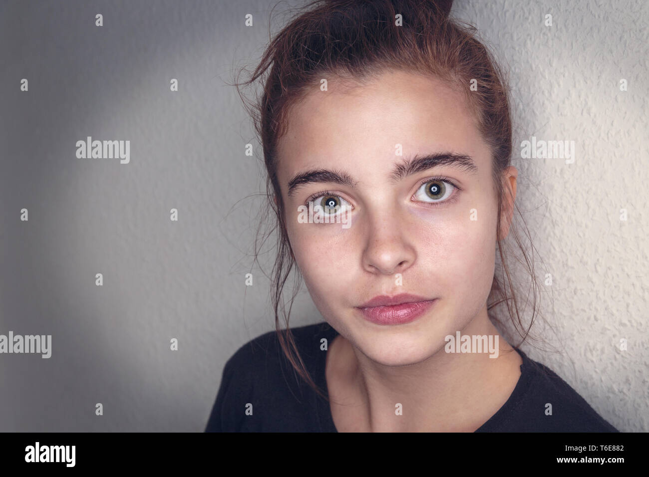 Portrait of a serious young woman Stock Photo - Alamy