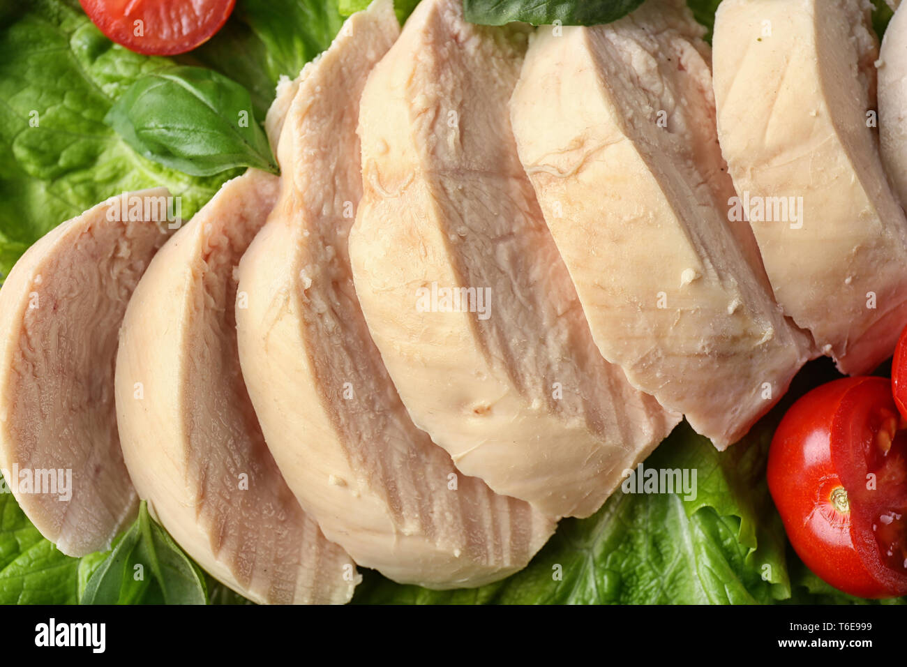 Pieces of sliced boiled chicken fillet, closeup Stock Photo - Alamy